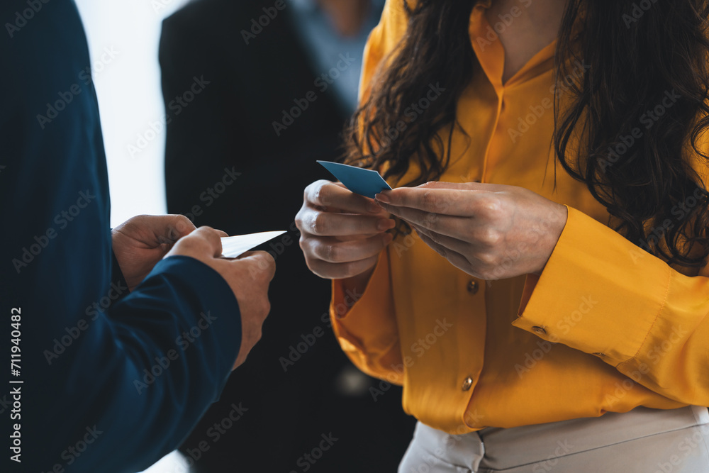 Successful businesswoman holding the name card during talking to ...