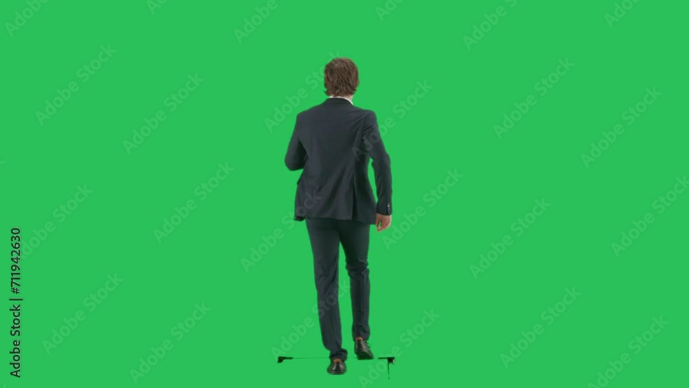 Back shot of male model in suit isolated on chroma key green screen ...