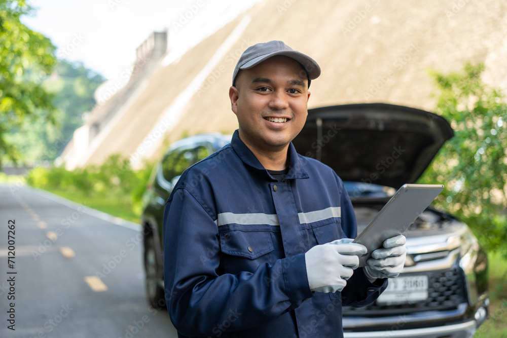 Professional car mechanic maintenance vehicle. The mechanic opens the ...