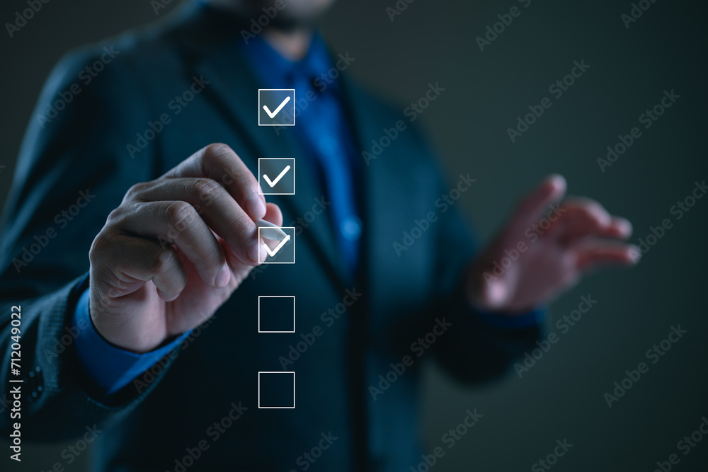 Business performance checklist, businessman using smartphone doing ...