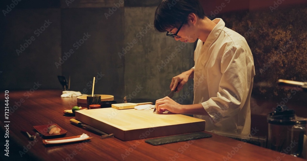 Japan chef, restaurant and cutting fish for sushi, glasses and ...