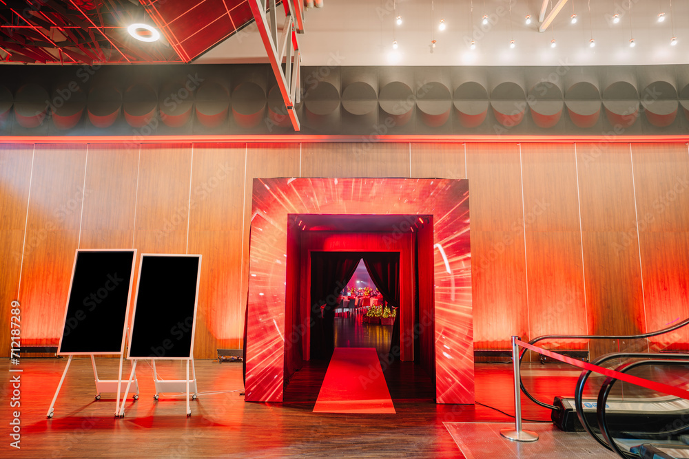 entrance with dynamic red lighting effects leading to an event space ...