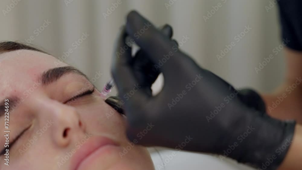 Close up of Botox injection. doctor's hands in gloves doing beauty ...