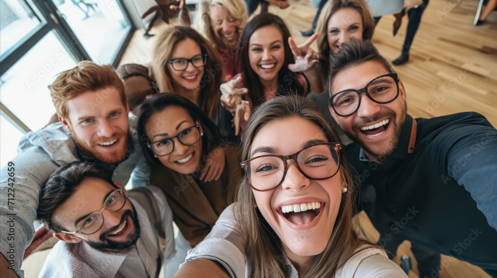 Capturing the moment, a group of friends poses for a selfie to ...