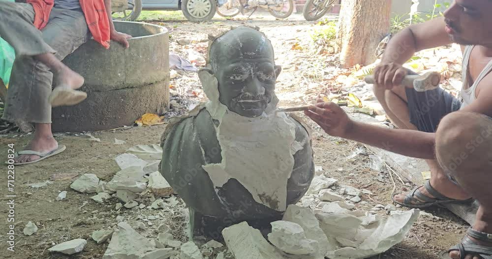 Artist is working and creates fibre half bust human man sculpture using ...