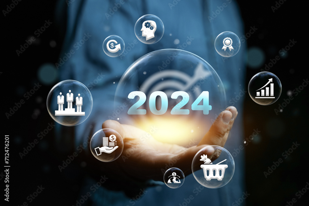 Implementation of the New Year goal plan 2024. Wooden cube with year ...