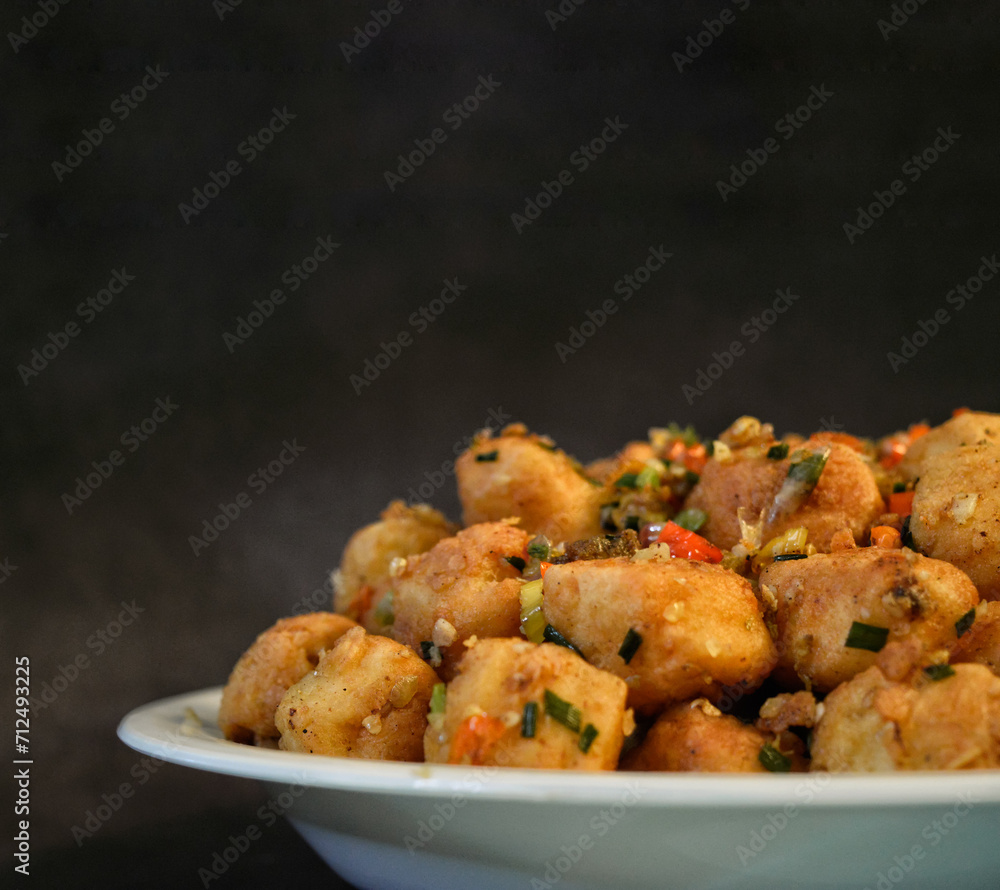 Tahu cabe garam, made from white tofu which is covered in flour and ...