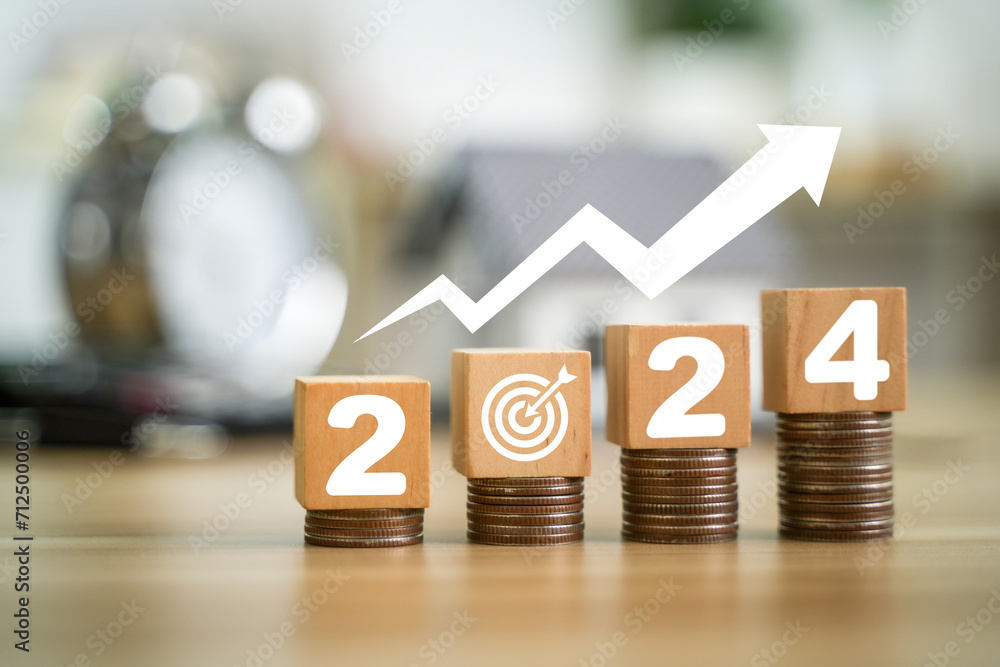 Implementation of the New Year goal plan 2024. Wooden cube with year ...