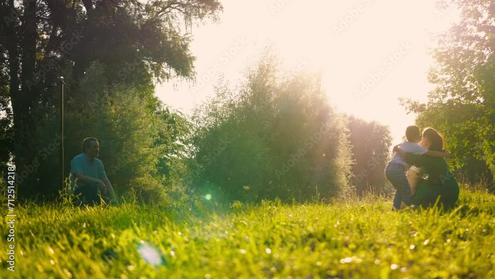 Delighted children run away from father hugging mother on vocation ...
