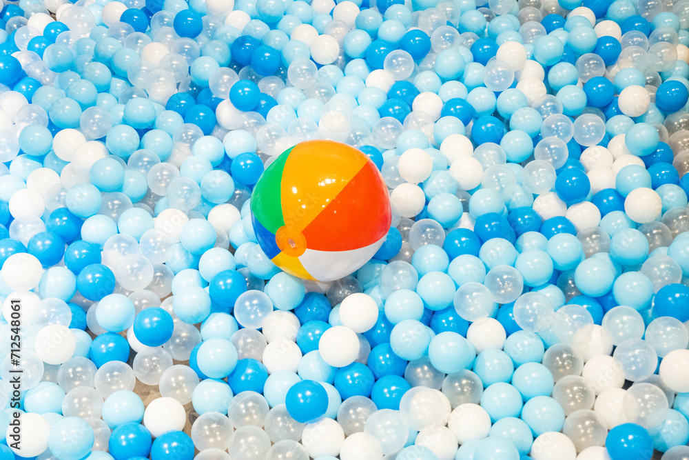 Colored plastic balls in pool of kindergarten school,White and blue ...