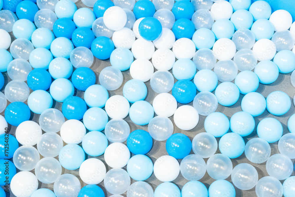 Colored plastic balls in pool of kindergarten school,White and blue ...