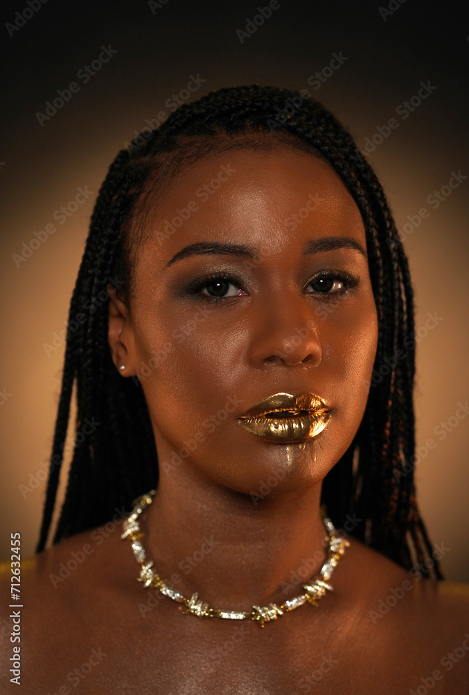 Portrait of a young African American woman with a gold necklace around ...