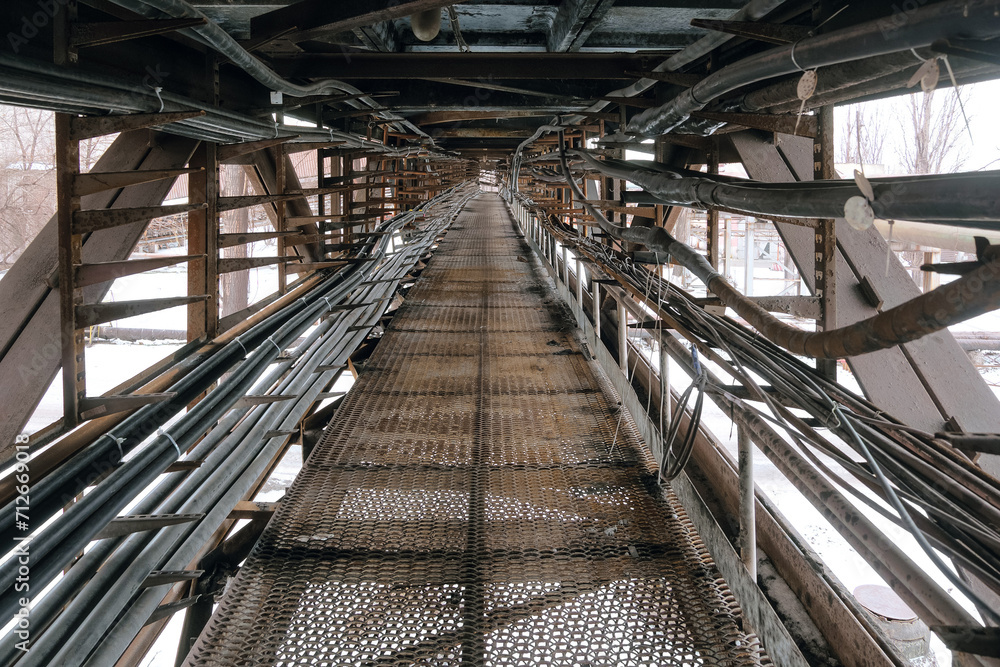 Сable ducts on a pass-through cable overpass. Outdoors industrial ...