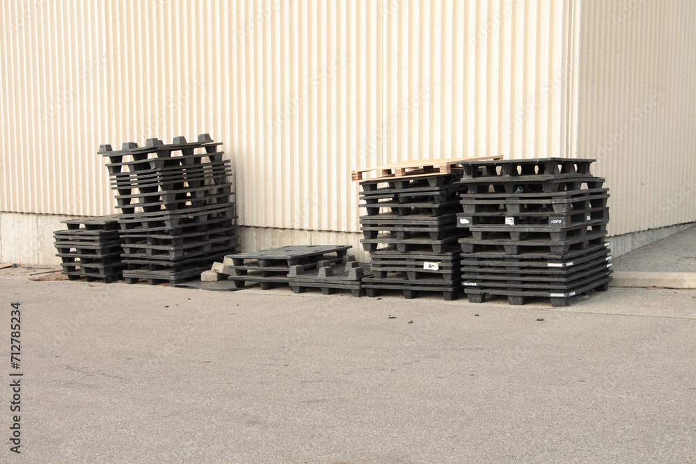 black plastic skids palettes stacked next to each other on sale with ...