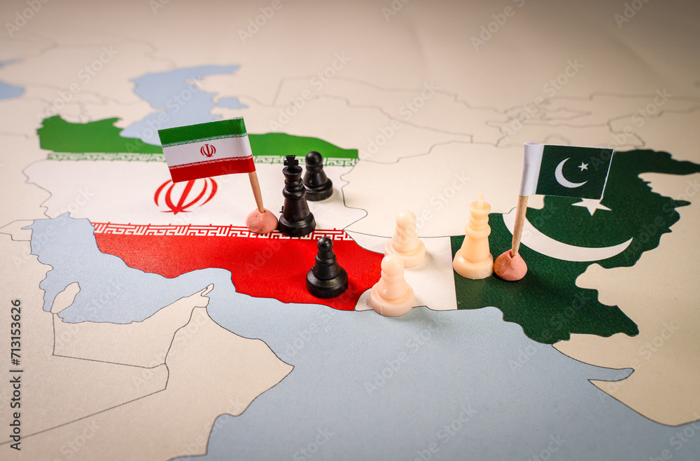 Chess pieces over a map of Pakistan and Iran. Conflict between Iran and ...