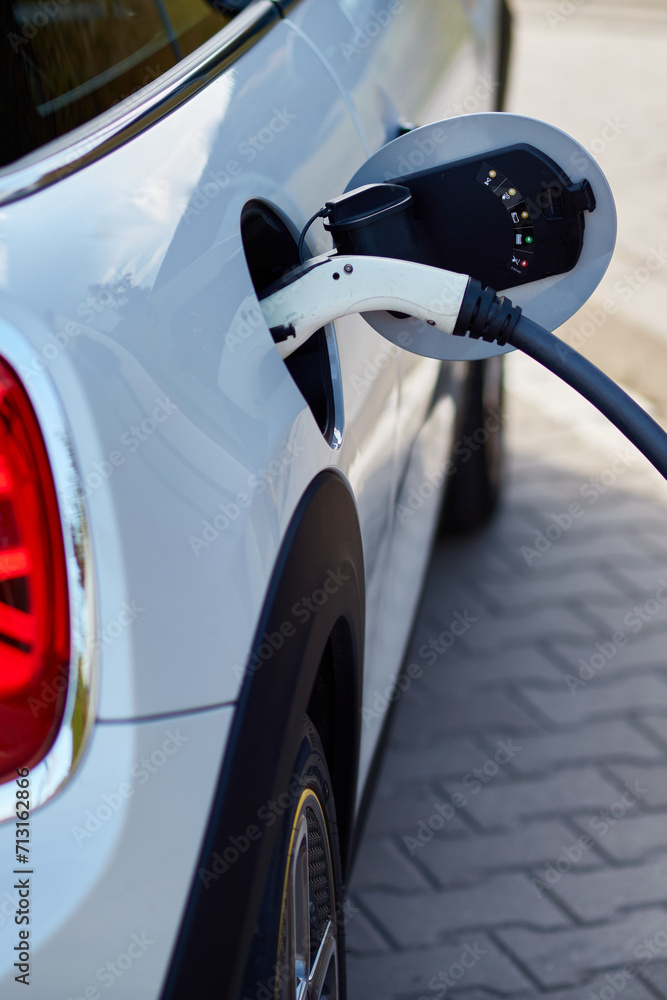 First fully electric Mini Cooper ES connected to a charging station ...