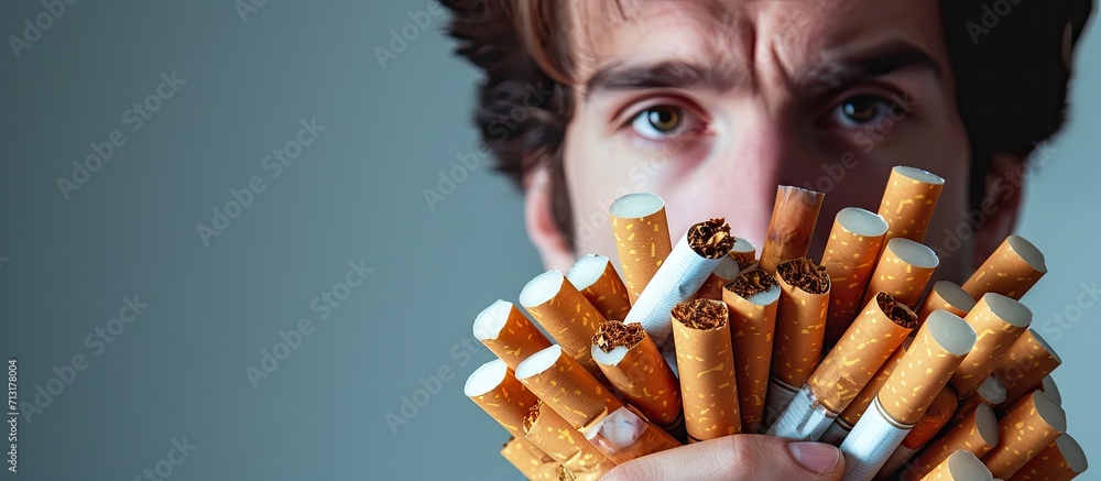 Male patient with several cigarettes bound together like sticks of ...