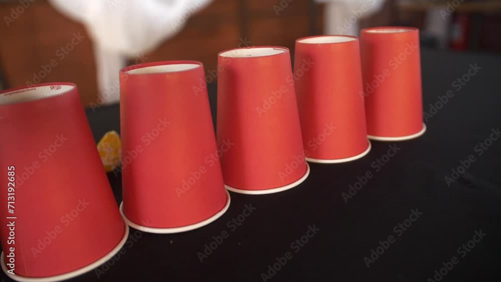 Seamless looping animation of assorted disposable red cups for coffee ...