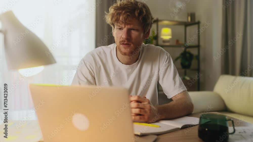 Portrait of amazed young man got notification message watch something ...