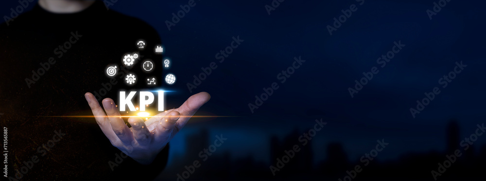 KPI: Man Holds Key Performance Indicator Icons. Data Analysis ...