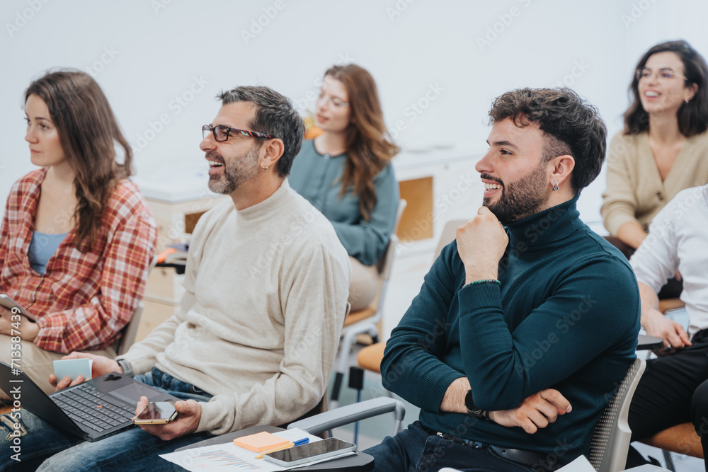A multi generational, group of adult students with positive expressions ...