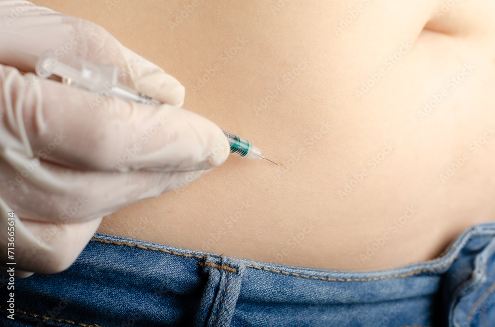 Syringe with needle for insulin isolated on light blue background with ...