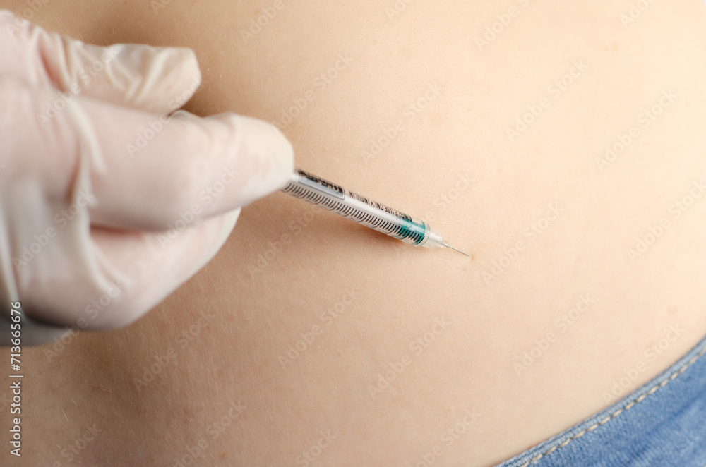 Syringe with needle for insulin isolated on light blue background with ...