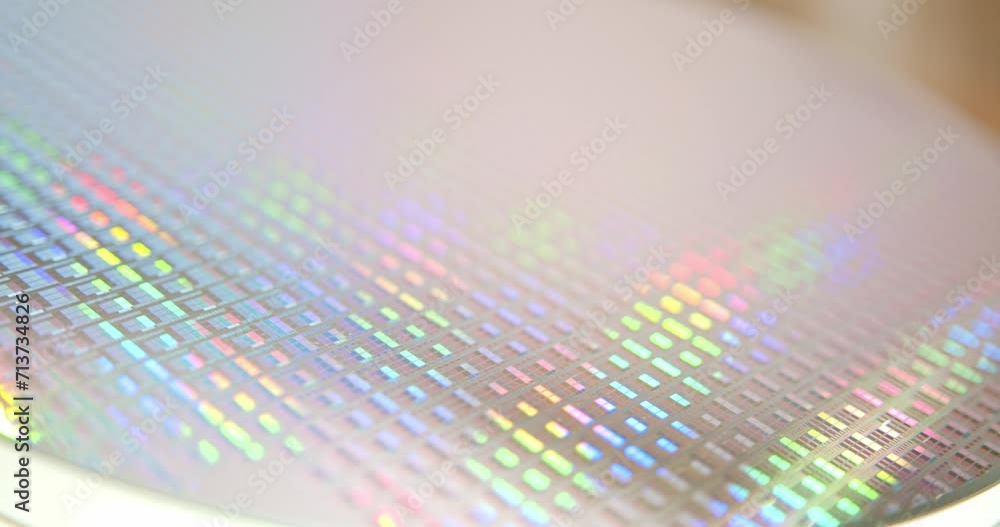 A close-up view of a silicon wafer's microprocessor circuit layout. The ...