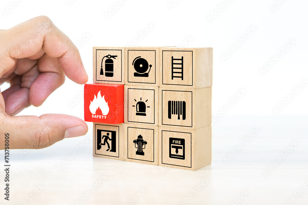 Fire prevention concept on cube wooden toy block stack with door exit ...