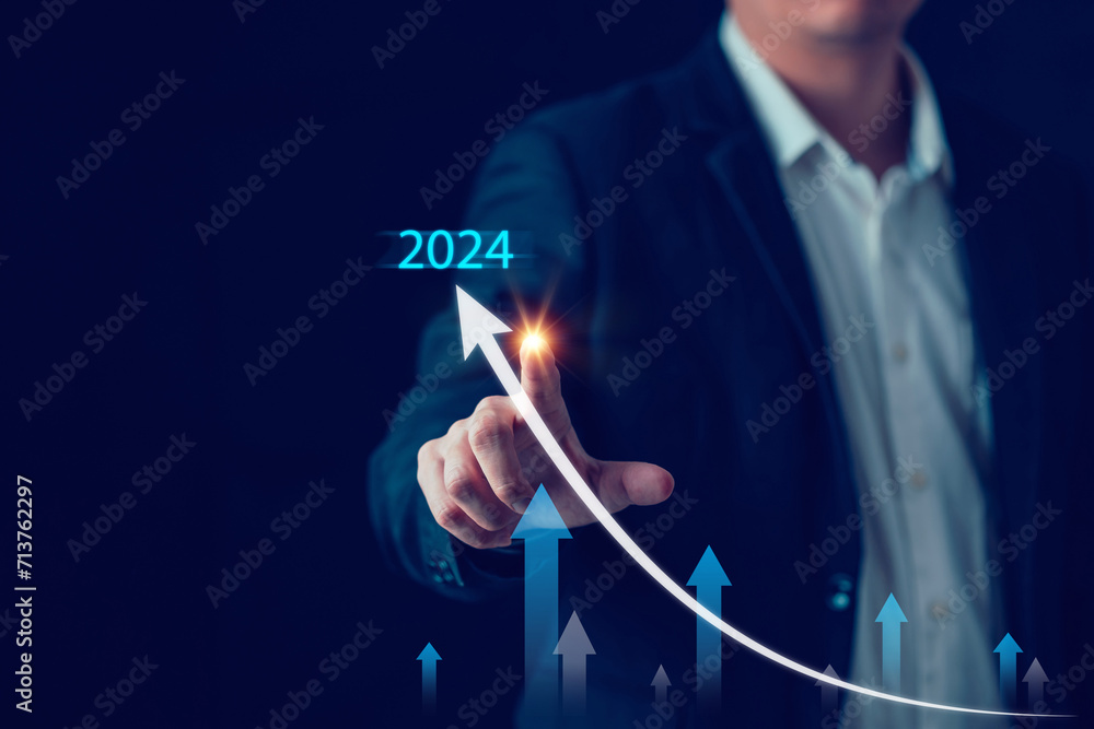 2024 Business goal, Business man pointing chart graph with 2024, future ...