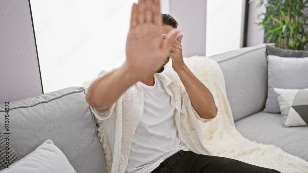 Embarrassed young arab man covers eyes with hands, fear expression ...