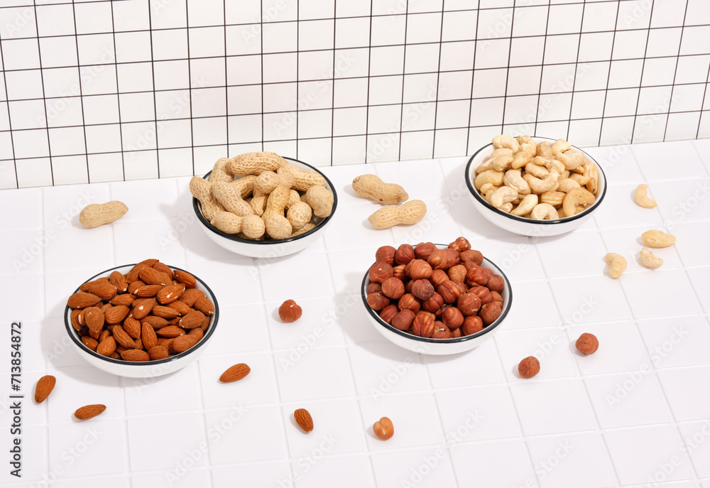 Different types of nuts on the table. Healthy eating and good nutrition ...