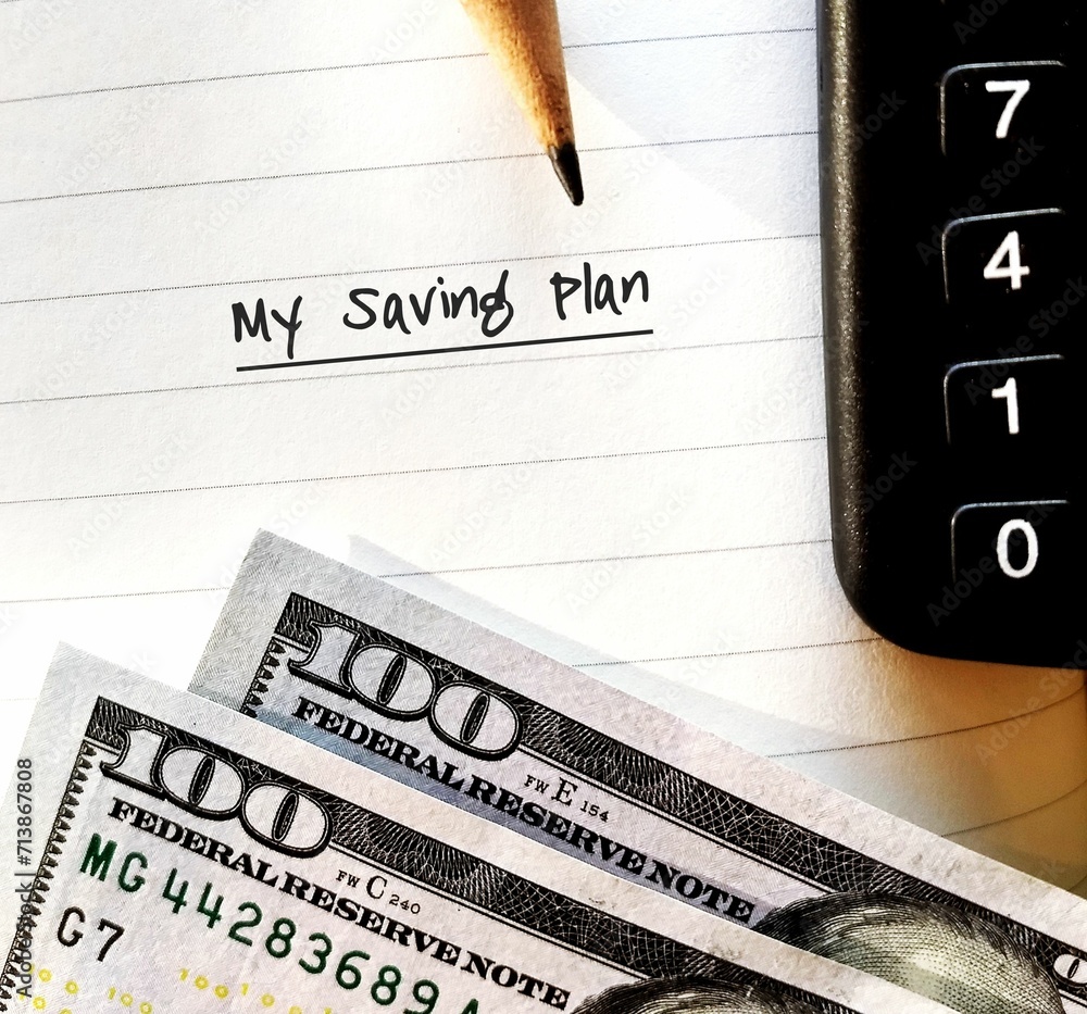 Calculator/pencil/cash in dollar and a paper sheet with handwriting ...