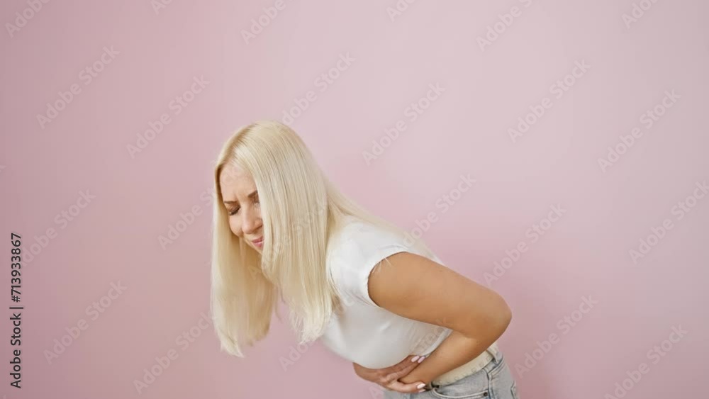 Vidéo Stock Painful bellyache, young blonde woman, doubled over in ...