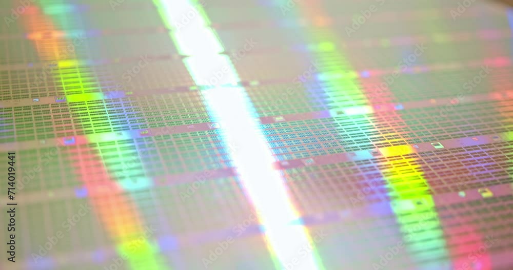 A close-up view of a silicon wafer's microprocessor circuit layout. The ...