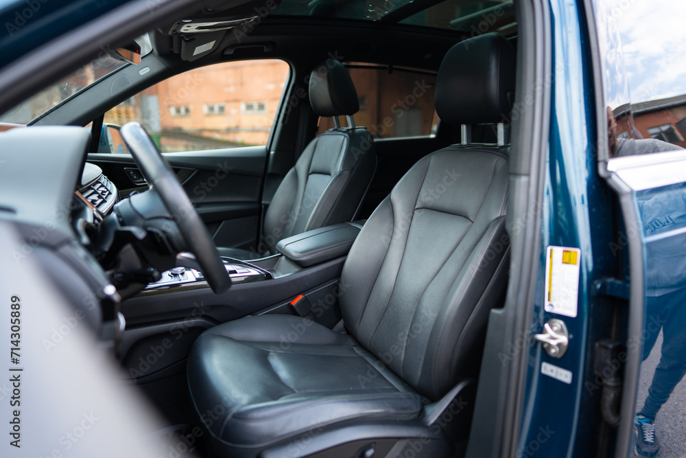 Side view of front seats inside brand new auto from driver's side with ...