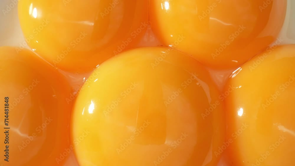 Close-up macro footage reveals the mesmerizing dance of a golden yolk ...