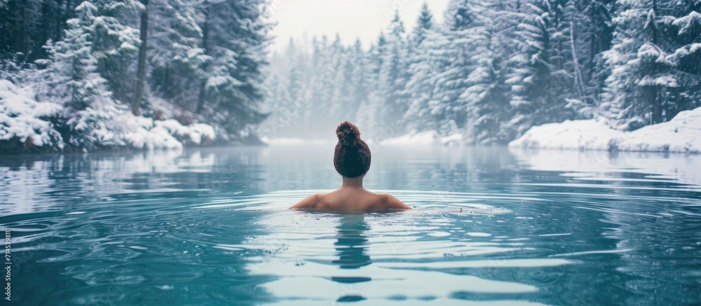 Cold water swimming, frozen lake, wellness, swimming in winter, young ...