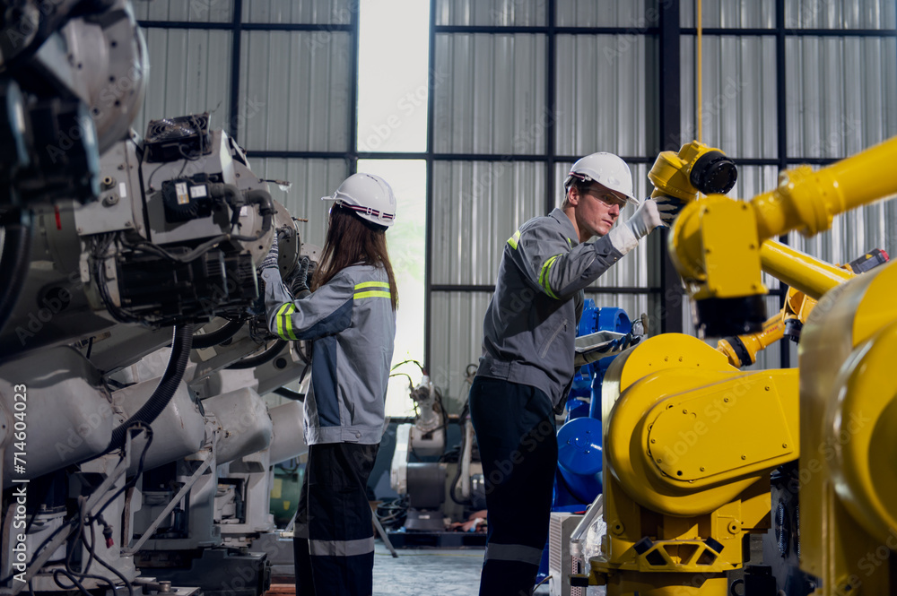 Engineer inspection control a robot arm welding machine with a remote ...