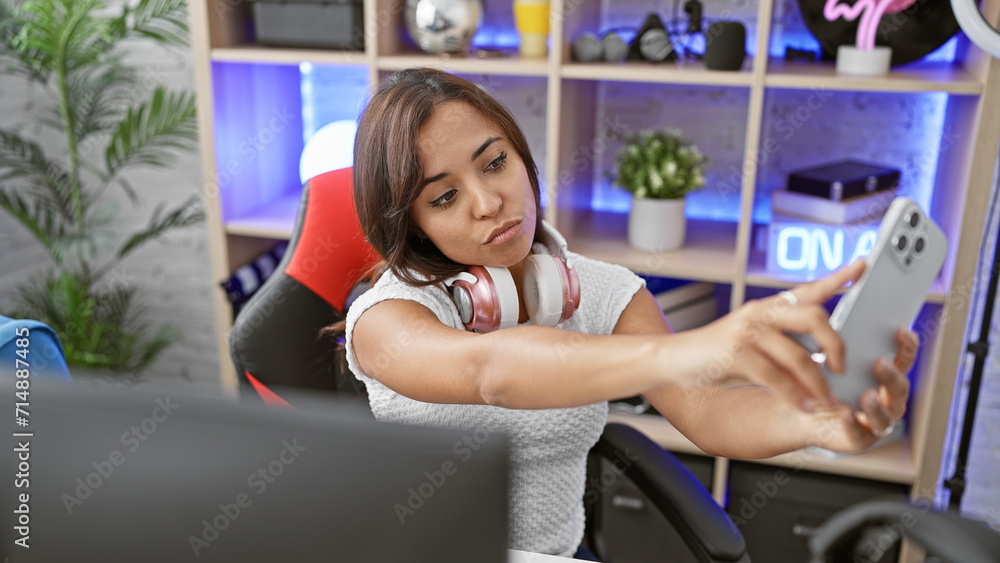 Captivating gamer girl magic! young and beautiful hispanic woman ...