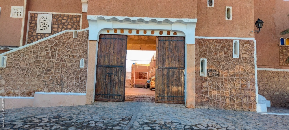 The main entrance to district of Ksar Tafilelt. With its houses made of ...