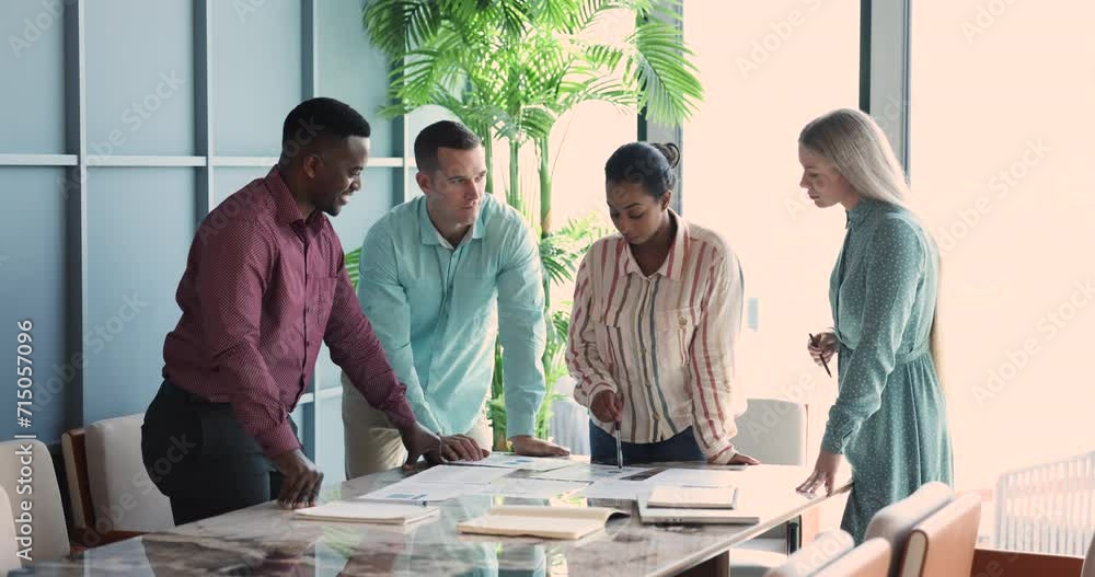 Group meeting of millennial diverse teammates review infographics data ...