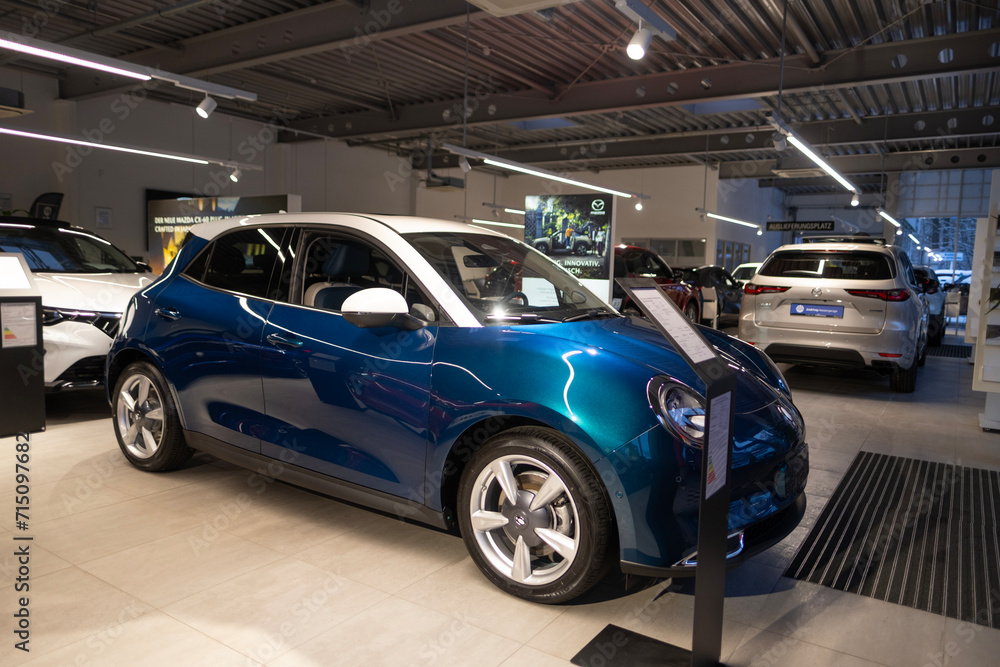 blue metallic electric car GWM ORA 03 in showroom, EV Great Wall Motors ...