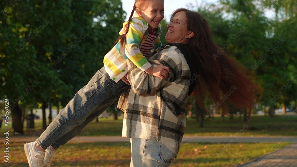 child girl daughter runs into mother arms, child mother happy face ...