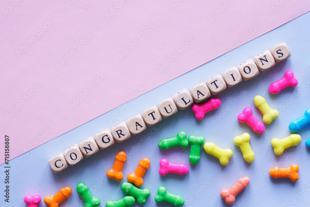 Inscription congratulations next to a lot of unusual brightly colored ...