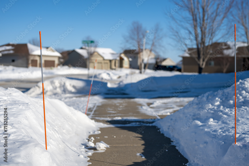 Sidewalk with edge markers used for snow blowing guides Stock Photo ...