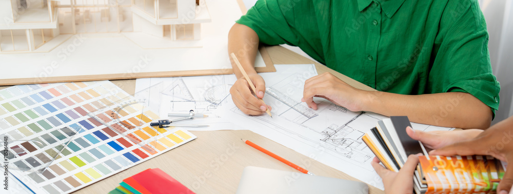 Professional architect drafts blueprint from project manager advice on ...