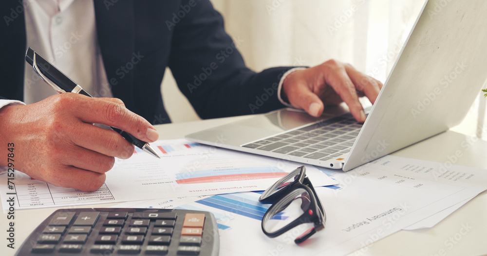 Asian businessman hands calculating number, graph, chart audit planning ...