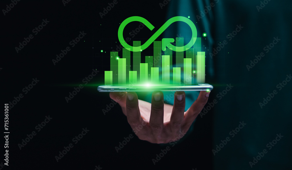 Businessman hold with virtual infinity symbol and business profit ...