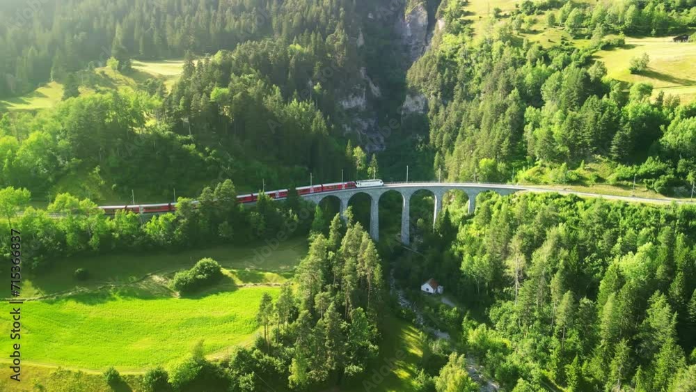 famous Glacier Express red swiss train on Landwasser viaduct bridge in ...